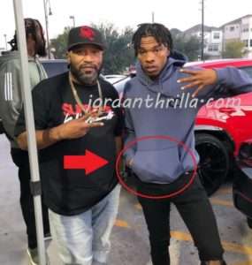 Gun Imprint from Lil Baby Clutching Gun in His Hoodie While in Houston ...
